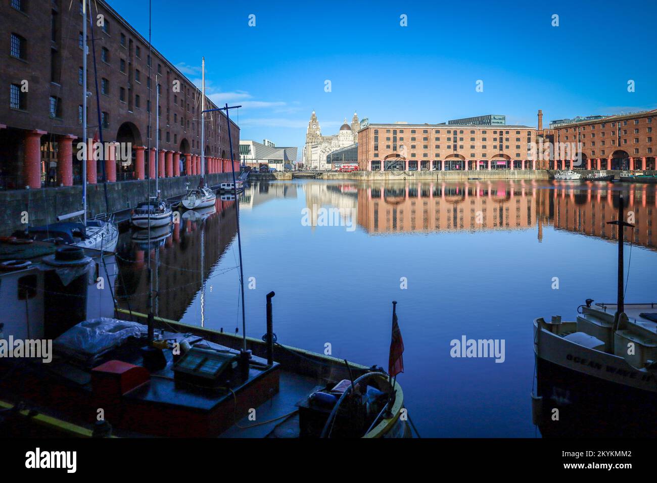 Liverpool Royal Albert Dock, Sunshine, blue sky and water reflection ...