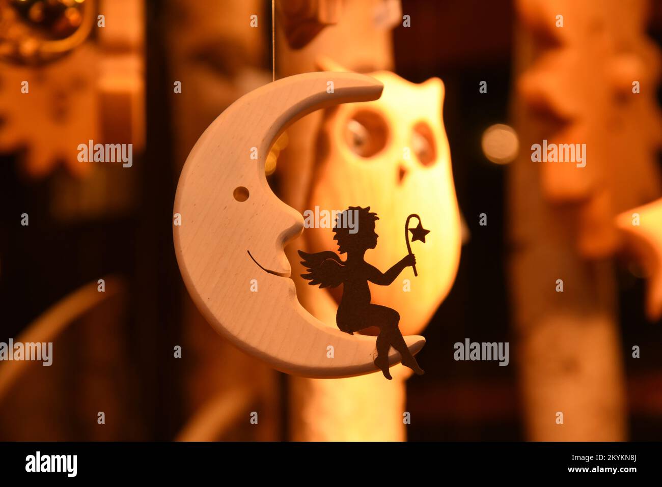 Angel sitting on the moon Stock Photo - Alamy