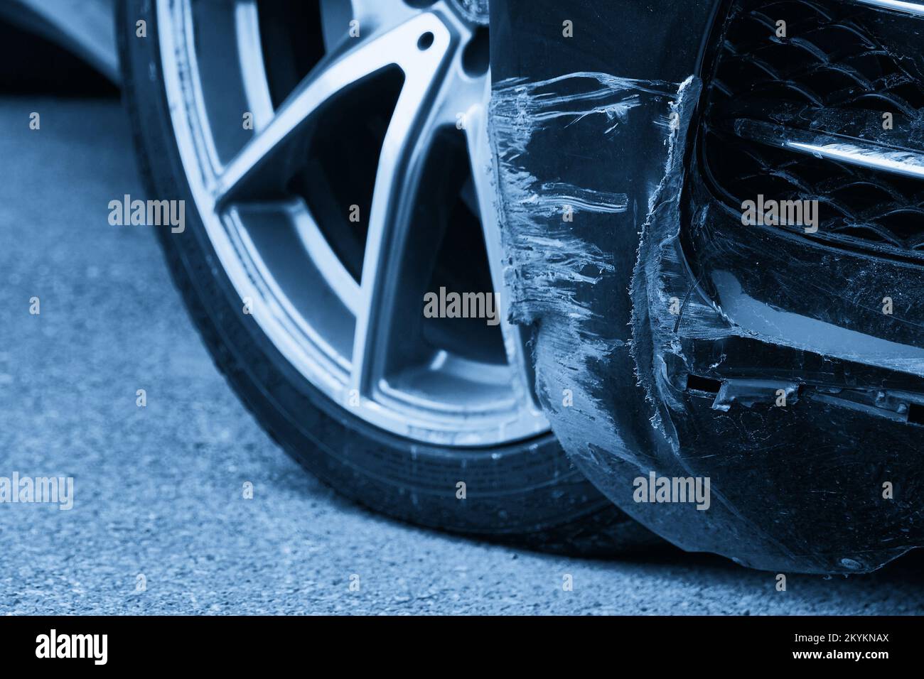Black bumper car scratched with deep damage to the paint Stock Photo ...