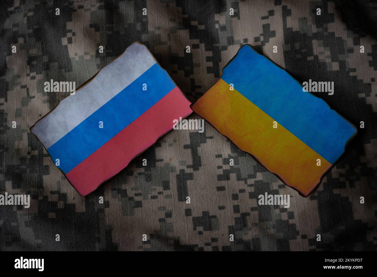 Russian and Ukrainian flags crossed on camouflage background Stock ...
