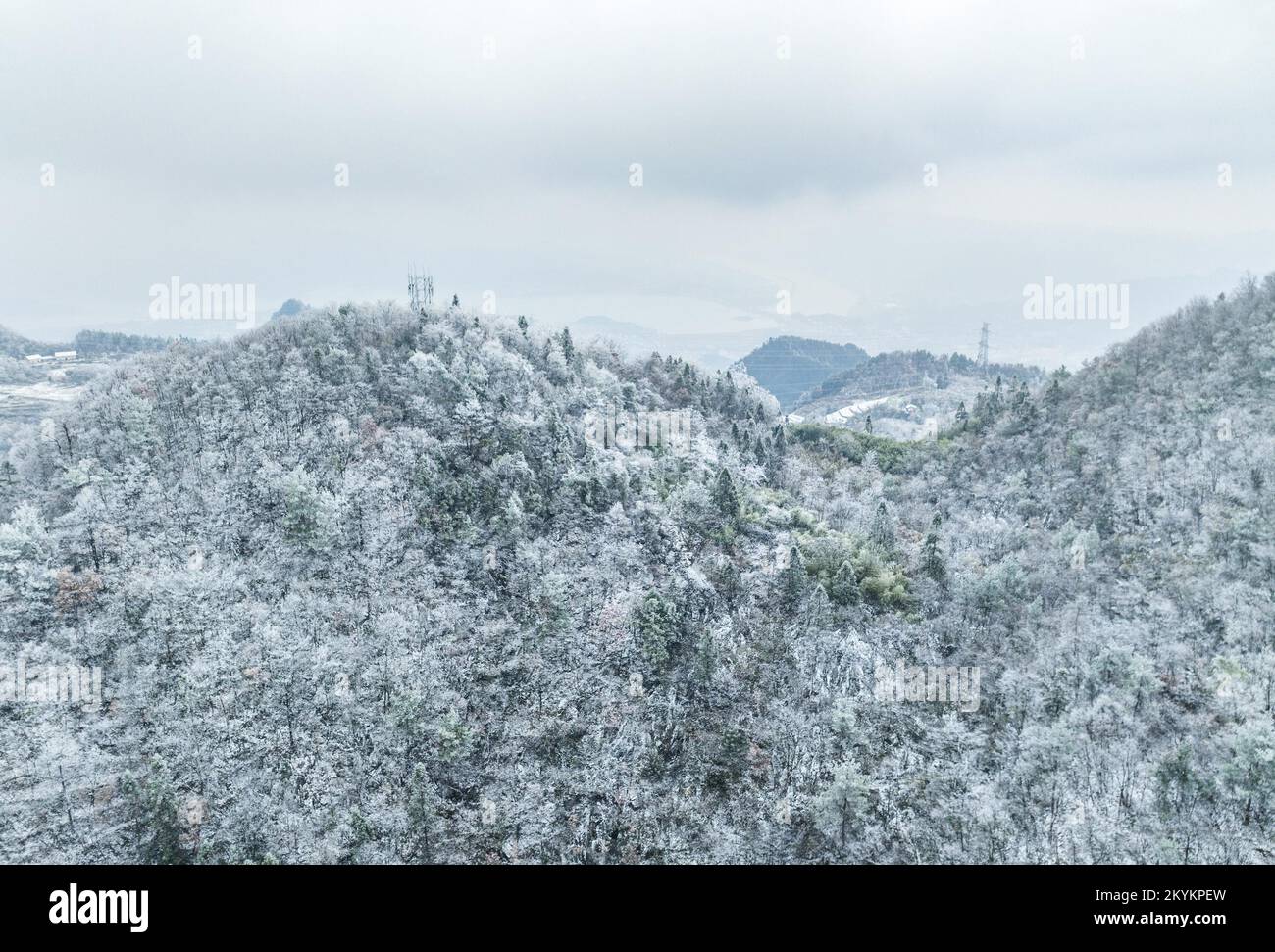 Aerial photo shows the snow scenery of Luo Jia Village, Maoping Town ...