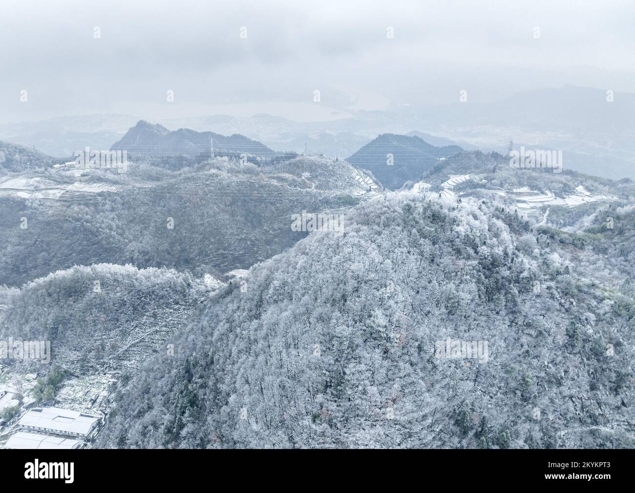 Aerial photo shows the snow scenery of Luo Jia Village, Maoping Town ...