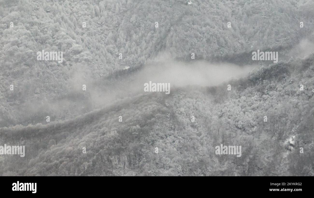 Aerial photo shows the snow scenery near the drainage divide of Qinling ...