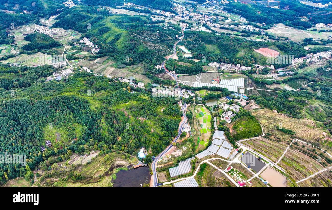 Aerial photo shows the Four Good Rural Road passing through the village ...
