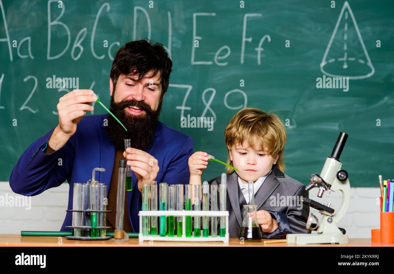 teacher man with little boy. Biology Science lab. Scientist research ...