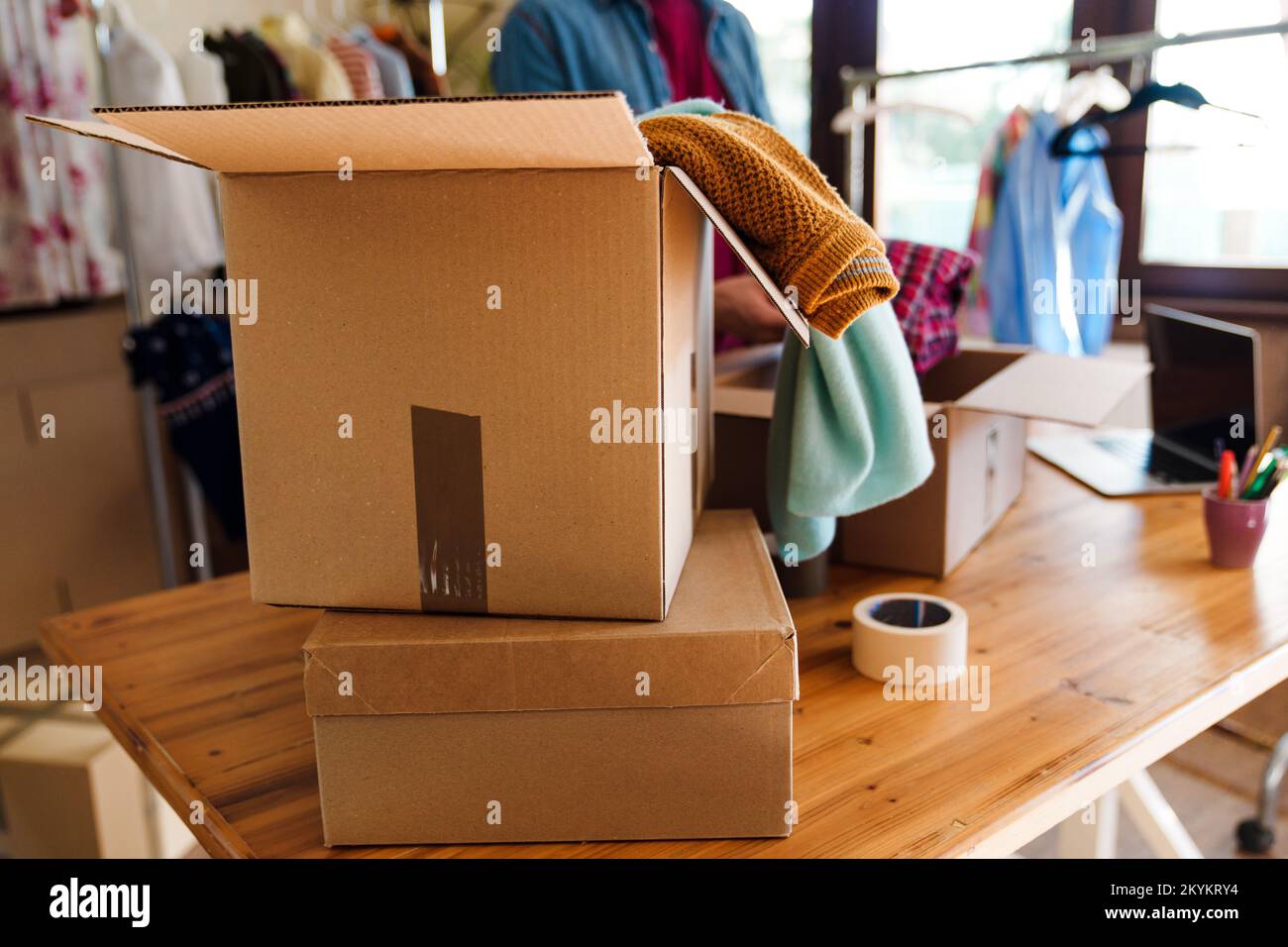 Pre owned clothes resale or donation Stock Photo - Alamy
