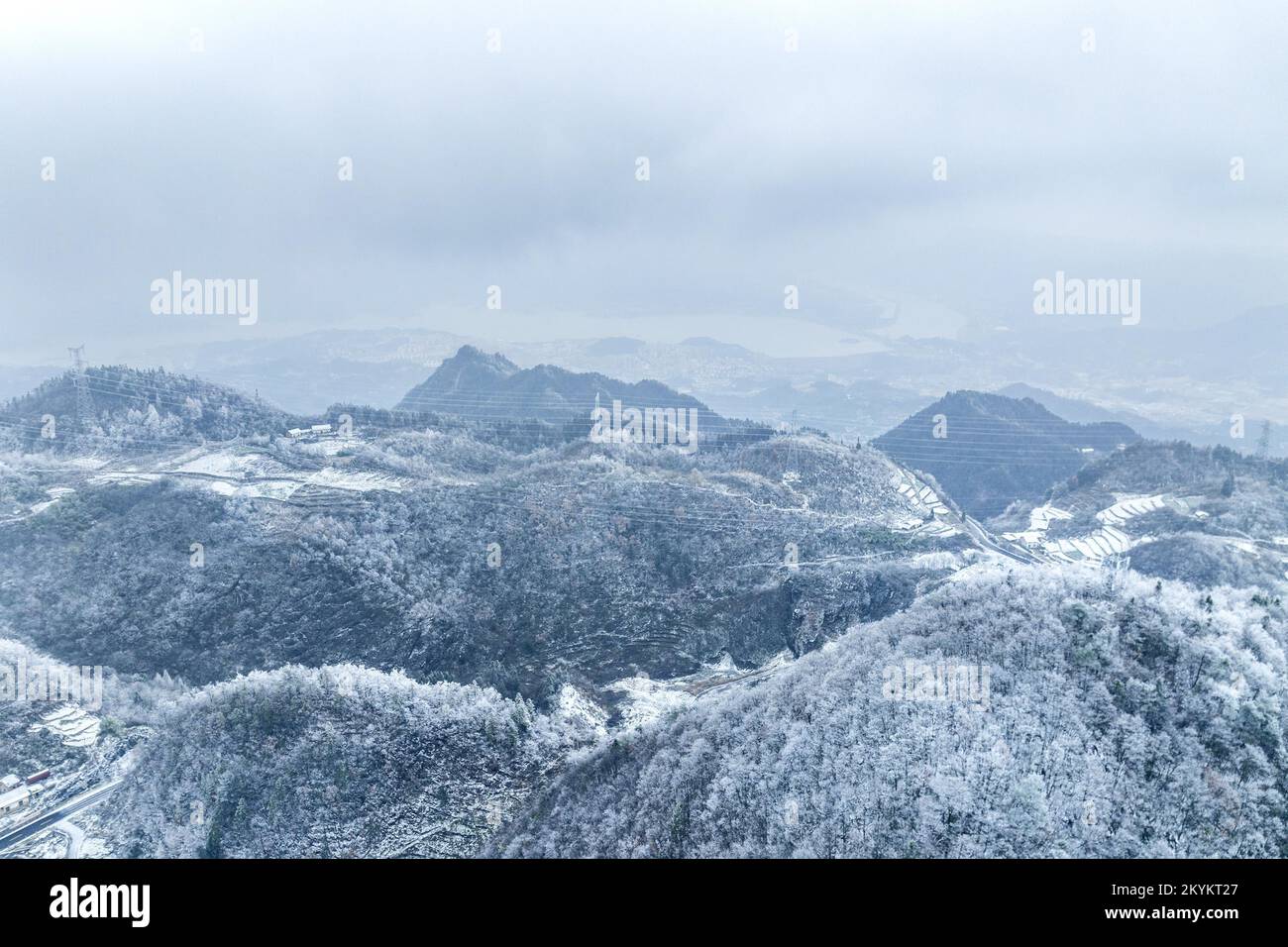 Aerial photo shows the snow scenery of Luo Jia Village, Maoping Town ...