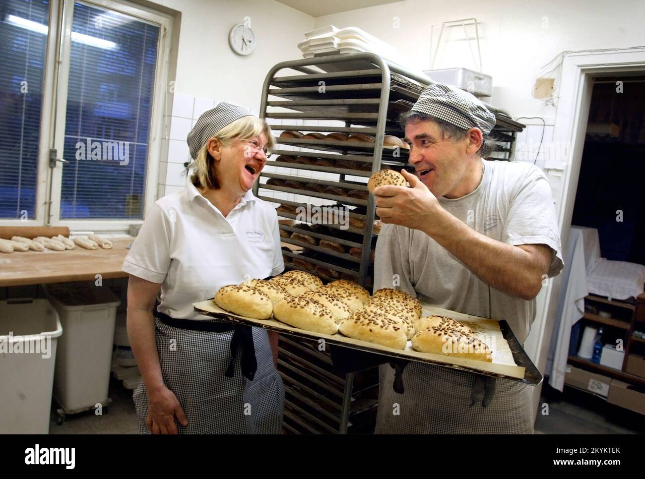 Early morning, bakers at a bakery Stock Photo - Alamy