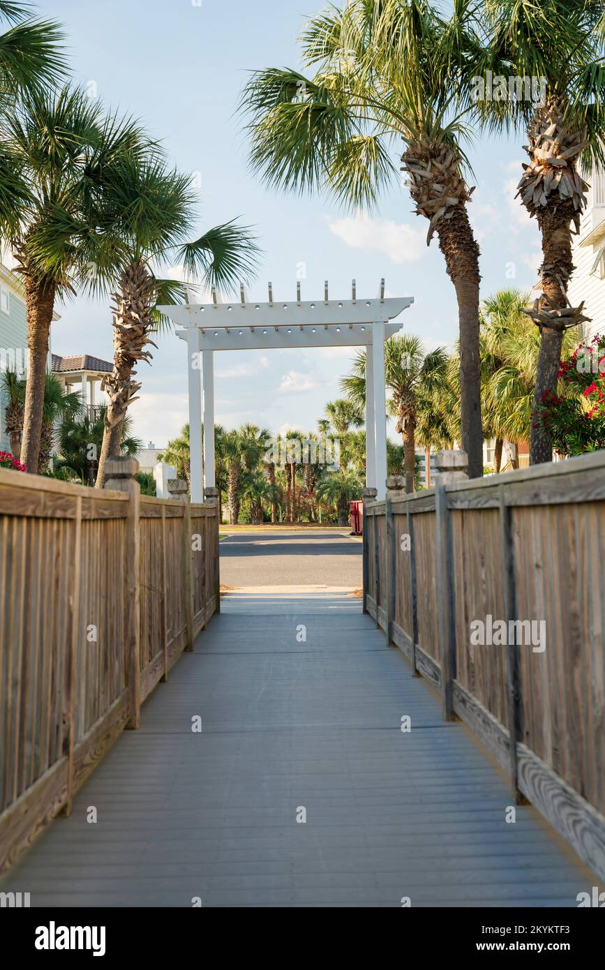 Destin, Florida- Perspective view of a boardwalk with pergola roof at ...