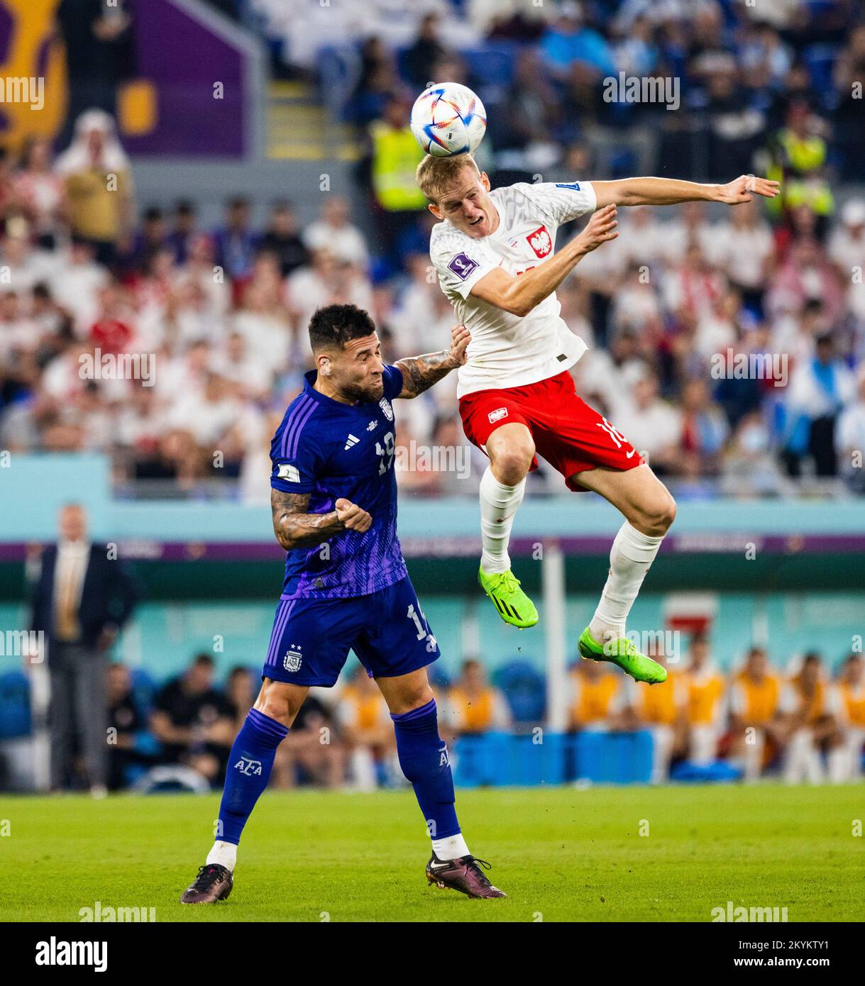 Doha, Qatar. 30th Nov, 2022. Nicolas Otamendi (Arg), Karol Swiderski ...
