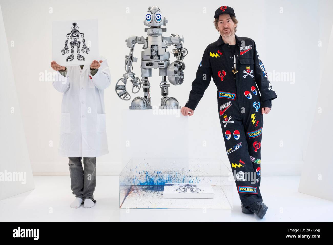 London, UK. 1 December 2022. Artist Philip Colbert (R) unveils ...