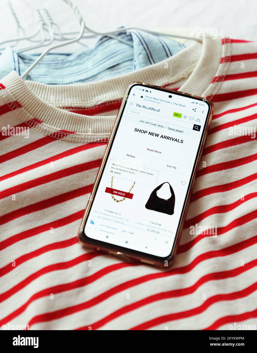 Smartphone with open site TheRealReal Stock Photo - Alamy
