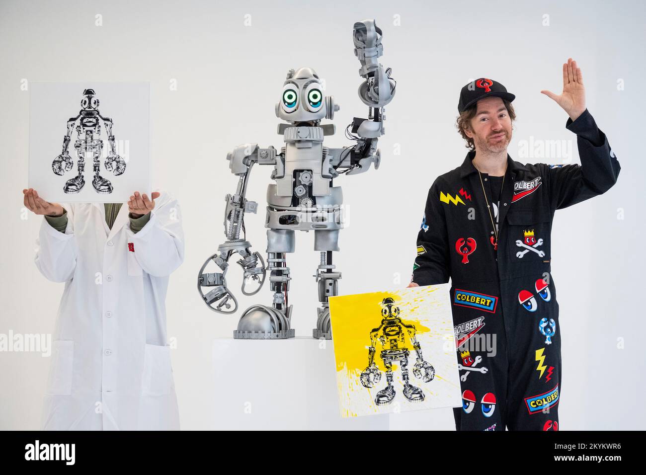 London, UK. 1 December 2022. Artist Philip Colbert (R) unveils ...