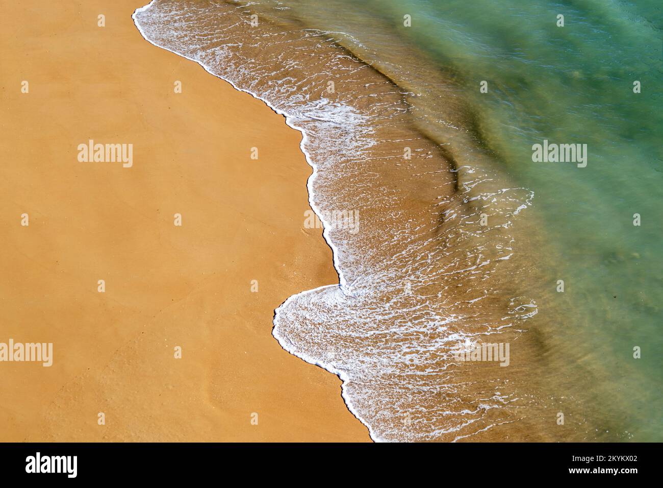 Aerial view of sandy beach and ocean with waves. Water Sand texture ...