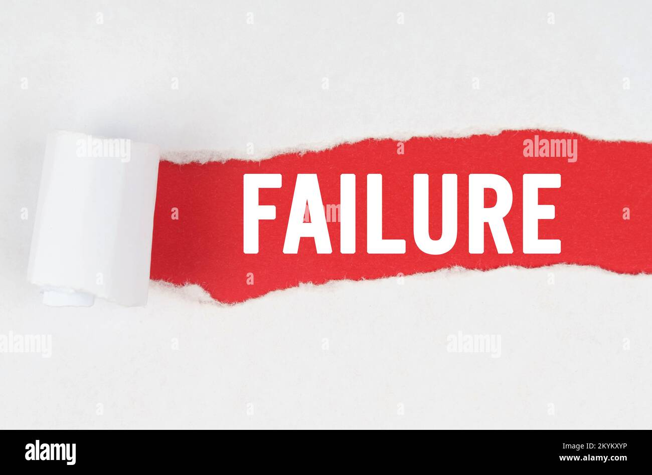 Business and finance. Behind torn white paper on a red background, the ...