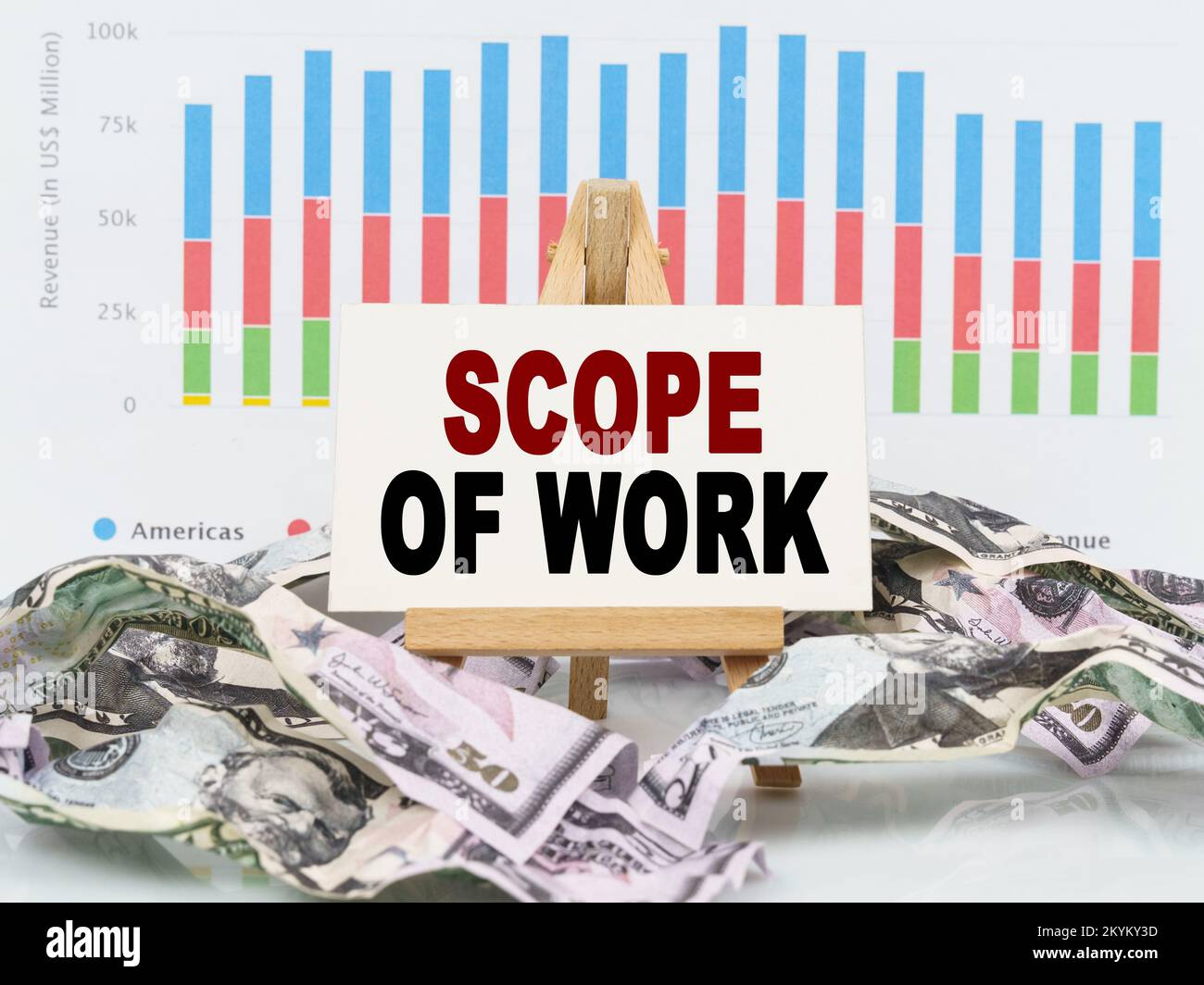 Business and finance concept. Among financial charts and money is a ...