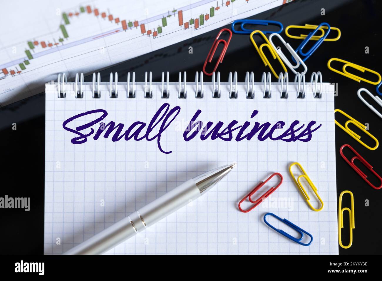 Finance and economics concept. On the desktop are a forex chart, paper ...