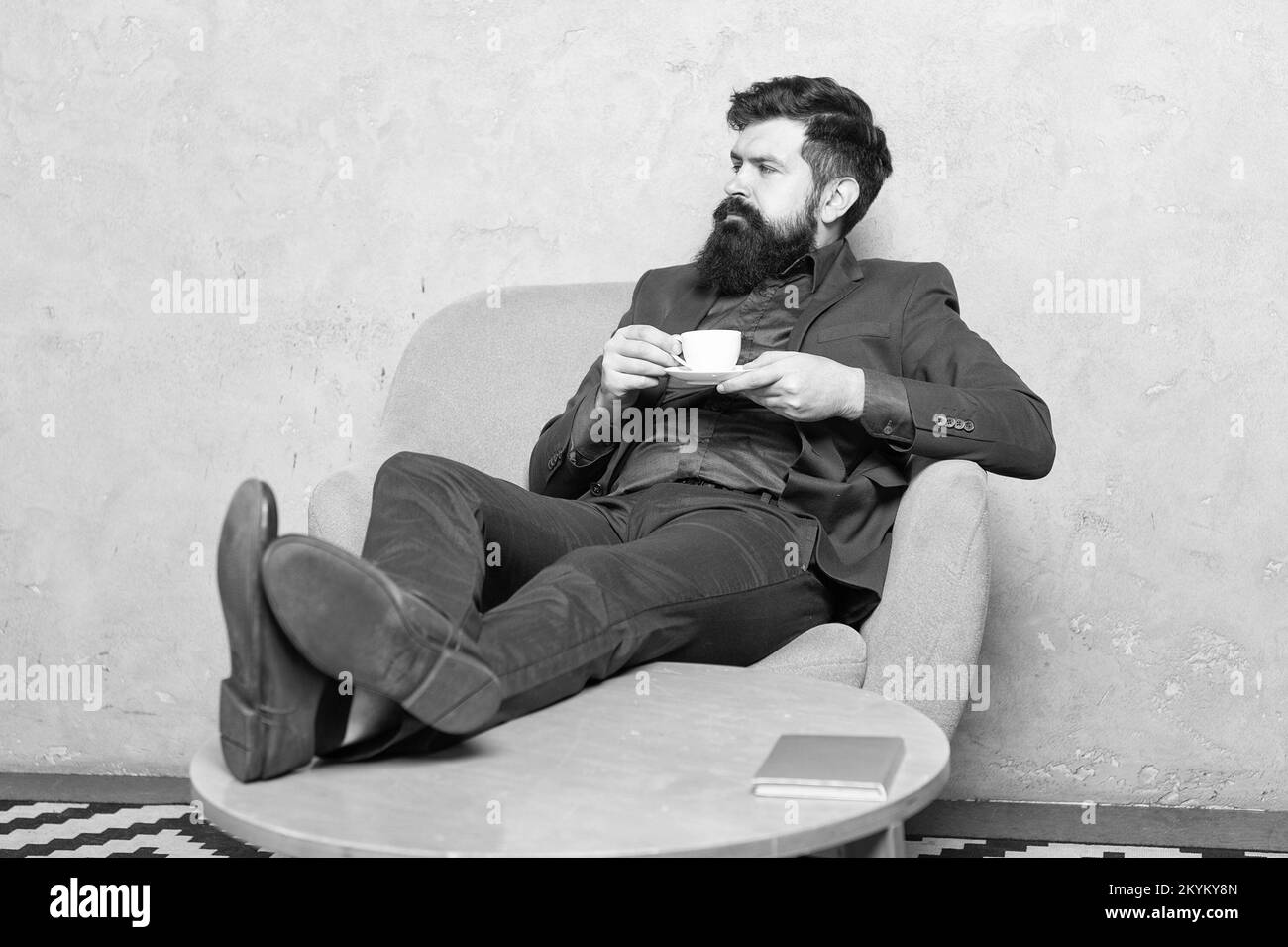 Taste of relaxation. Lawyer drink tea in armchair. Bearded man have ...
