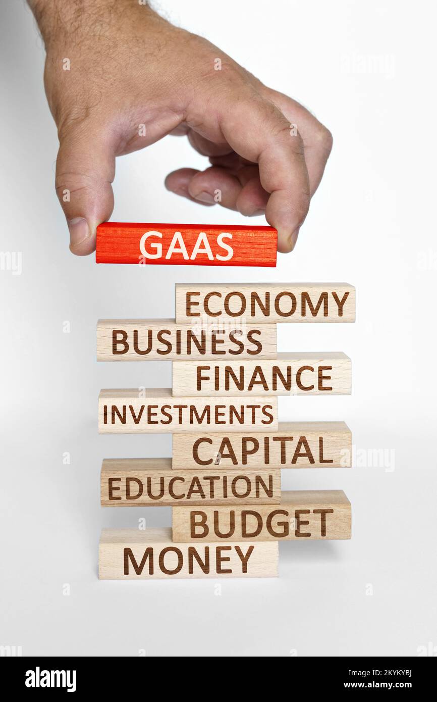 Business concept. Businessman hand sets on a tower with business words ...