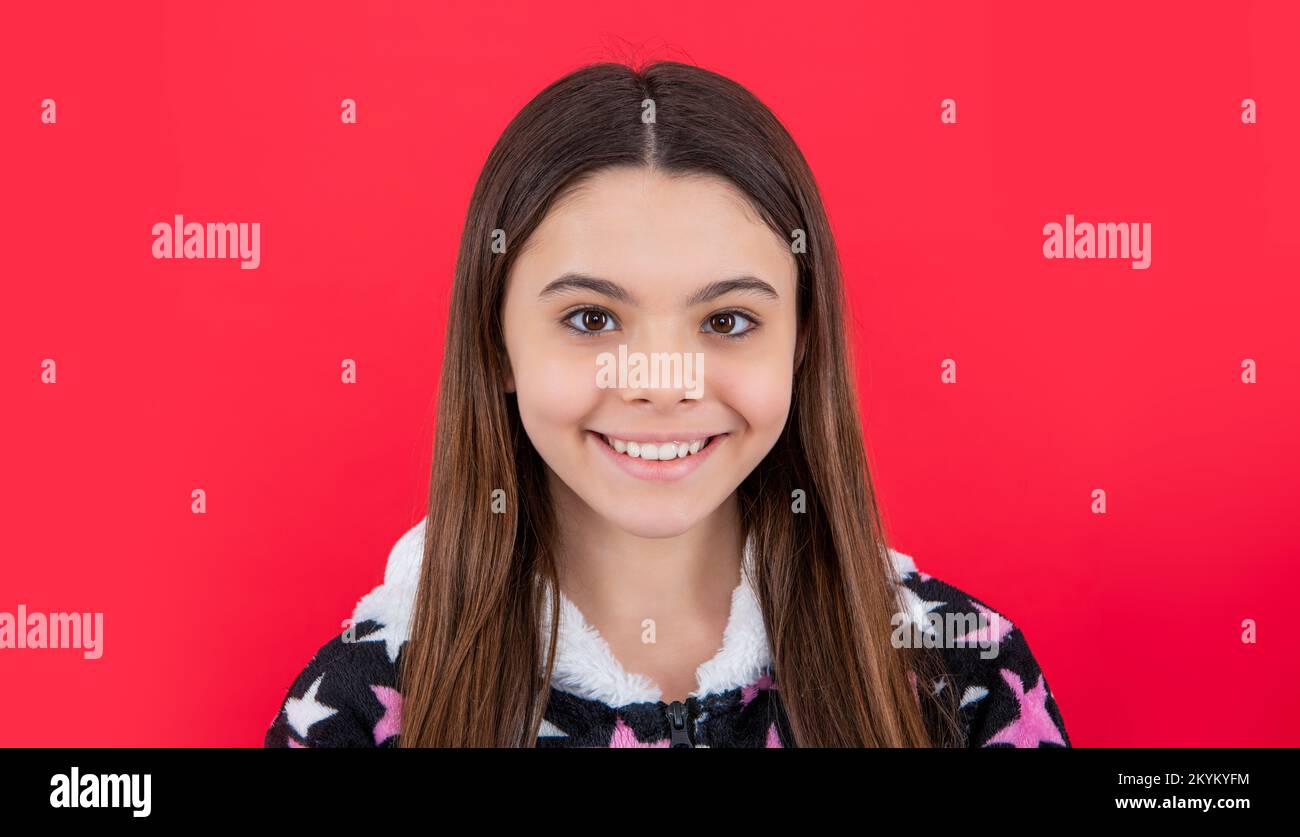 face portrait of teen girl isolated on red background. portrait of teen ...