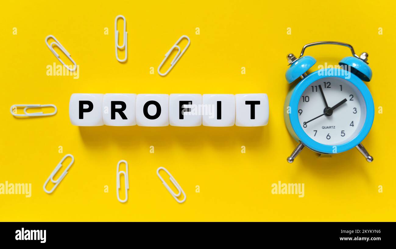 Finance and economics concept. On a yellow background, a blue alarm ...