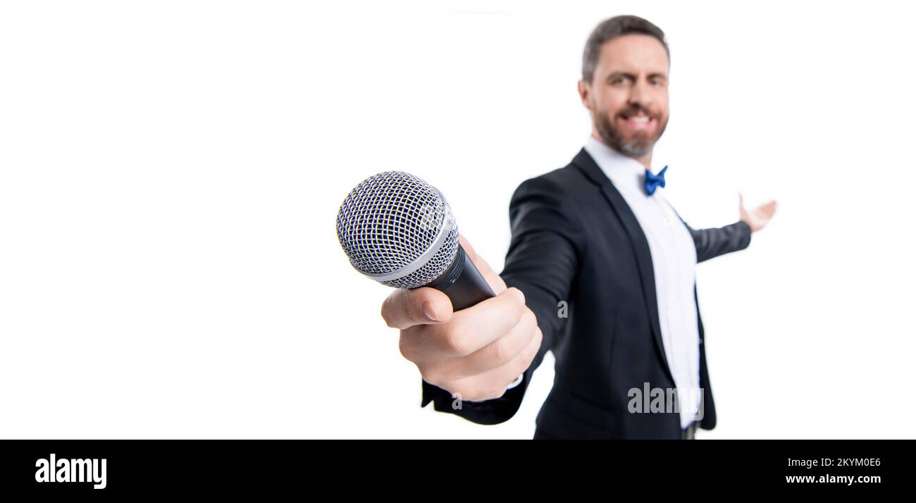 presenter man with microphone, copy space. man presenter wear tuxedo in ...