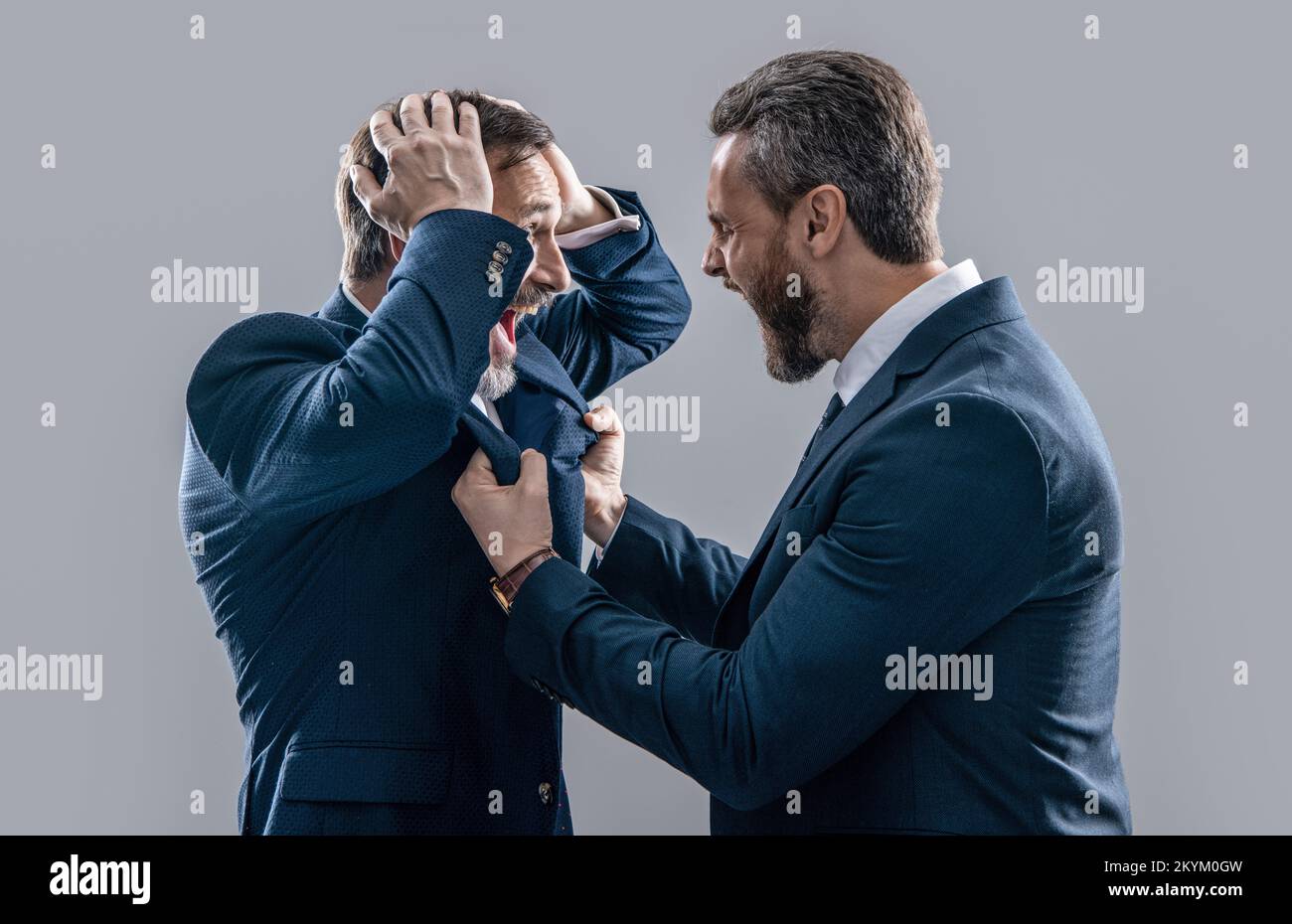 two arguing businessmen isolated on grey backdrop. businessmen arguing ...