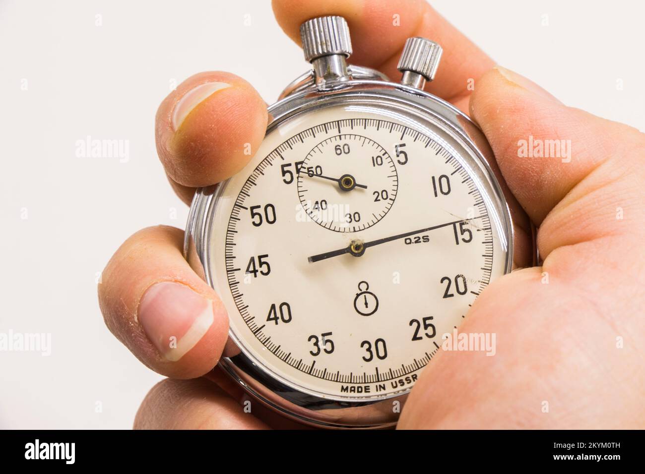 Old antiquary timer clock and humans hand, white background Stock Photo ...
