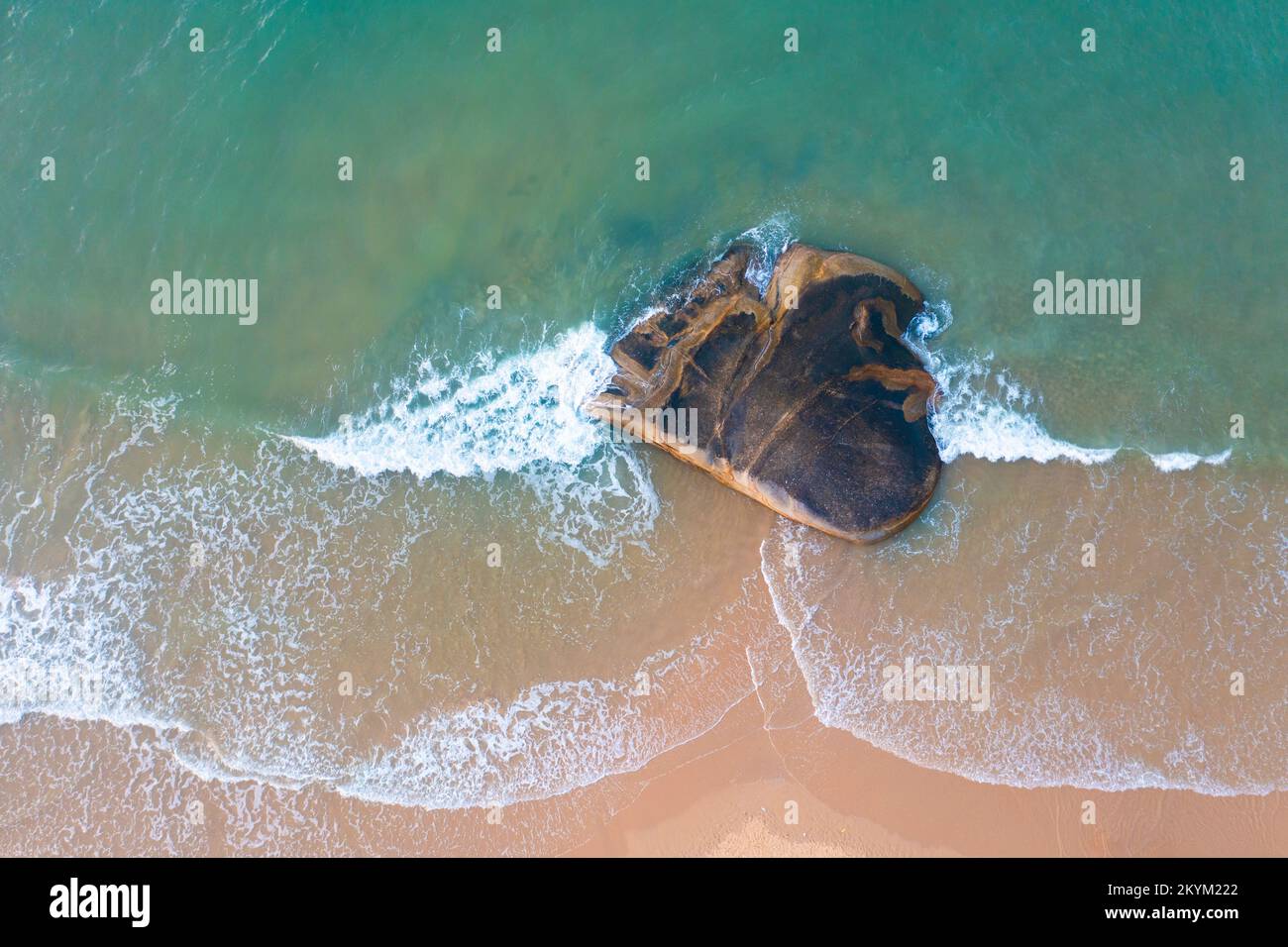 The beach in Quanzhou, Fujian, China, with green sea water and golden ...