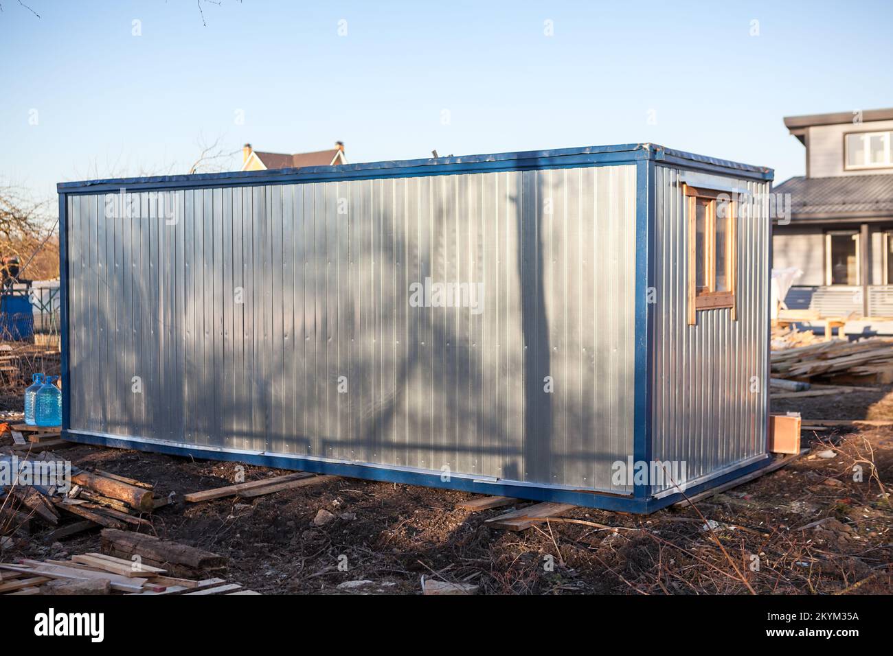 Temporary small house during the construction of a country house, side ...