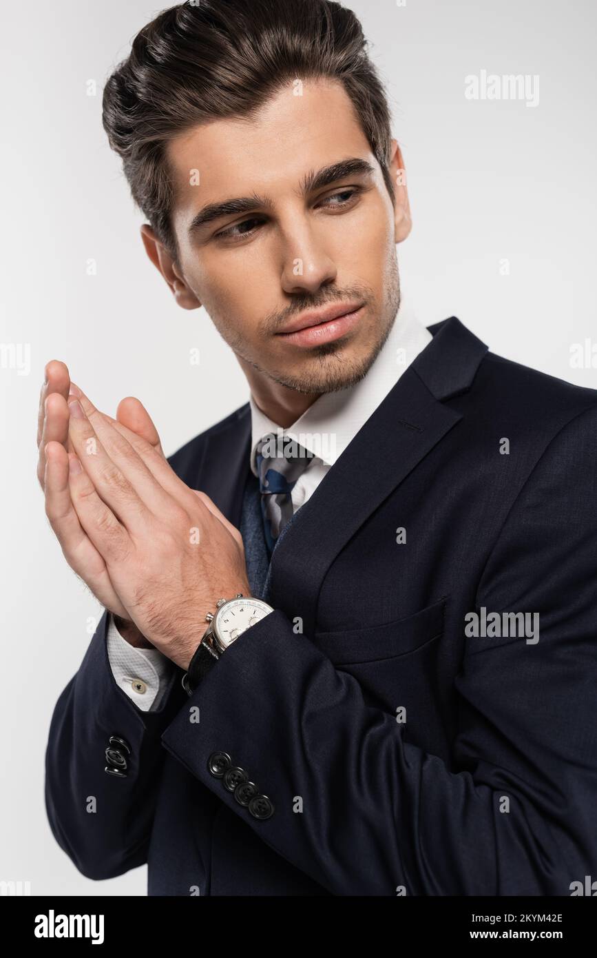 portrait of good looking and young businessman in formal wear isolated ...