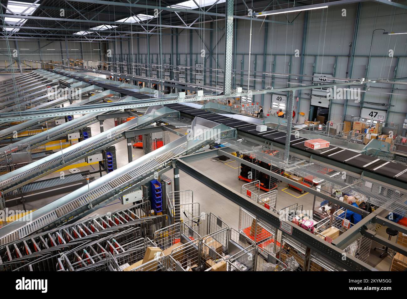 WESTZAAN - Employees of post and parcel delivery company PostNL sort ...
