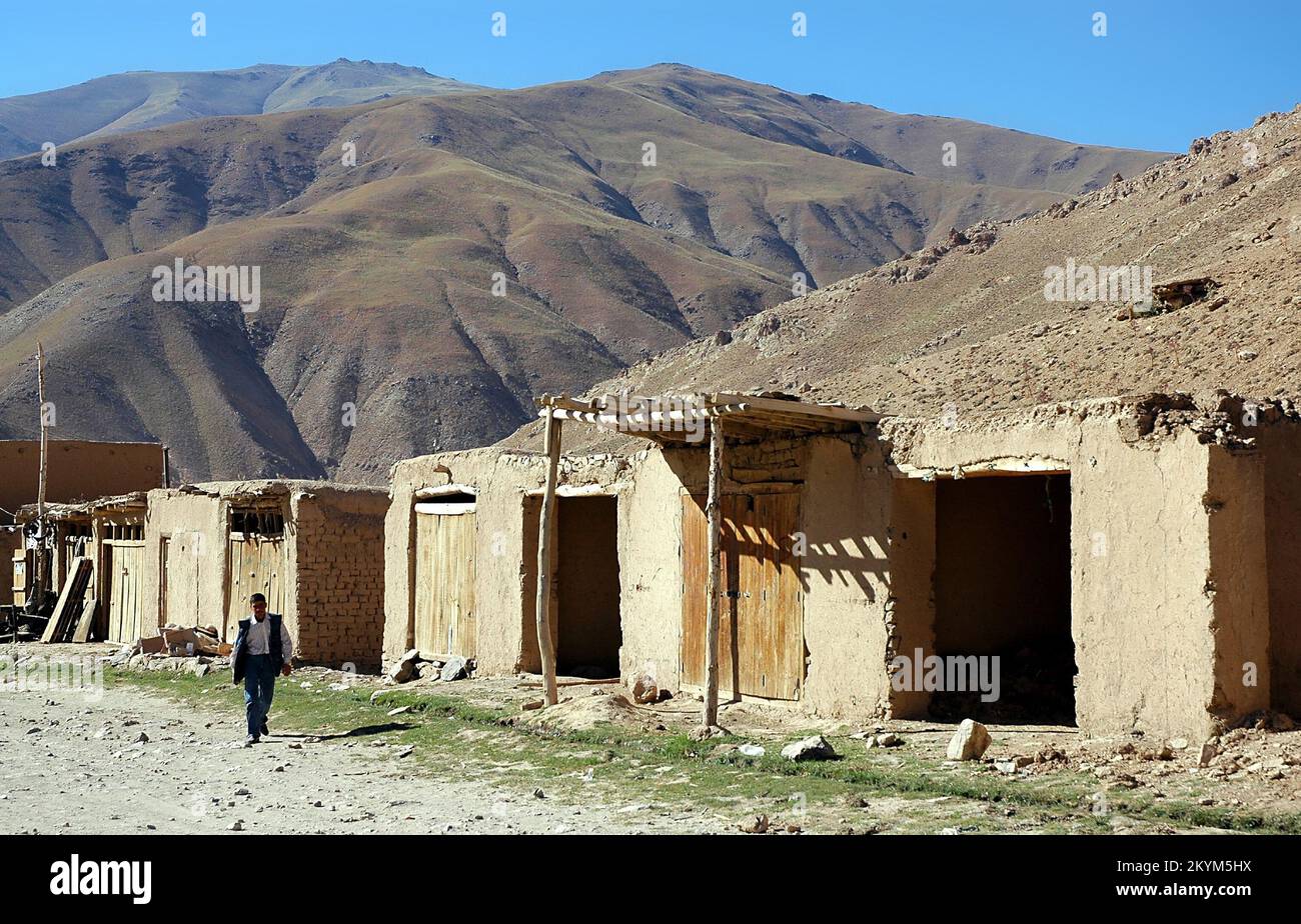 Village between Kabul and Bamyan (Bamiyan) / Afghanistan: A man walks ...