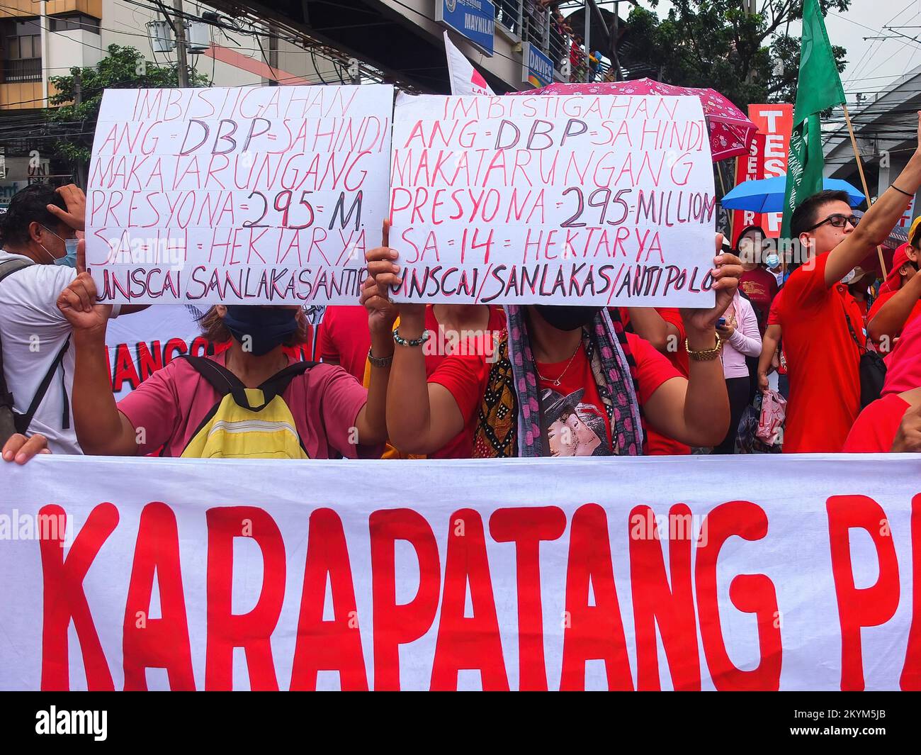 Manila, Philippines. 30th Nov, 2022. Protesters hold placards and a ...