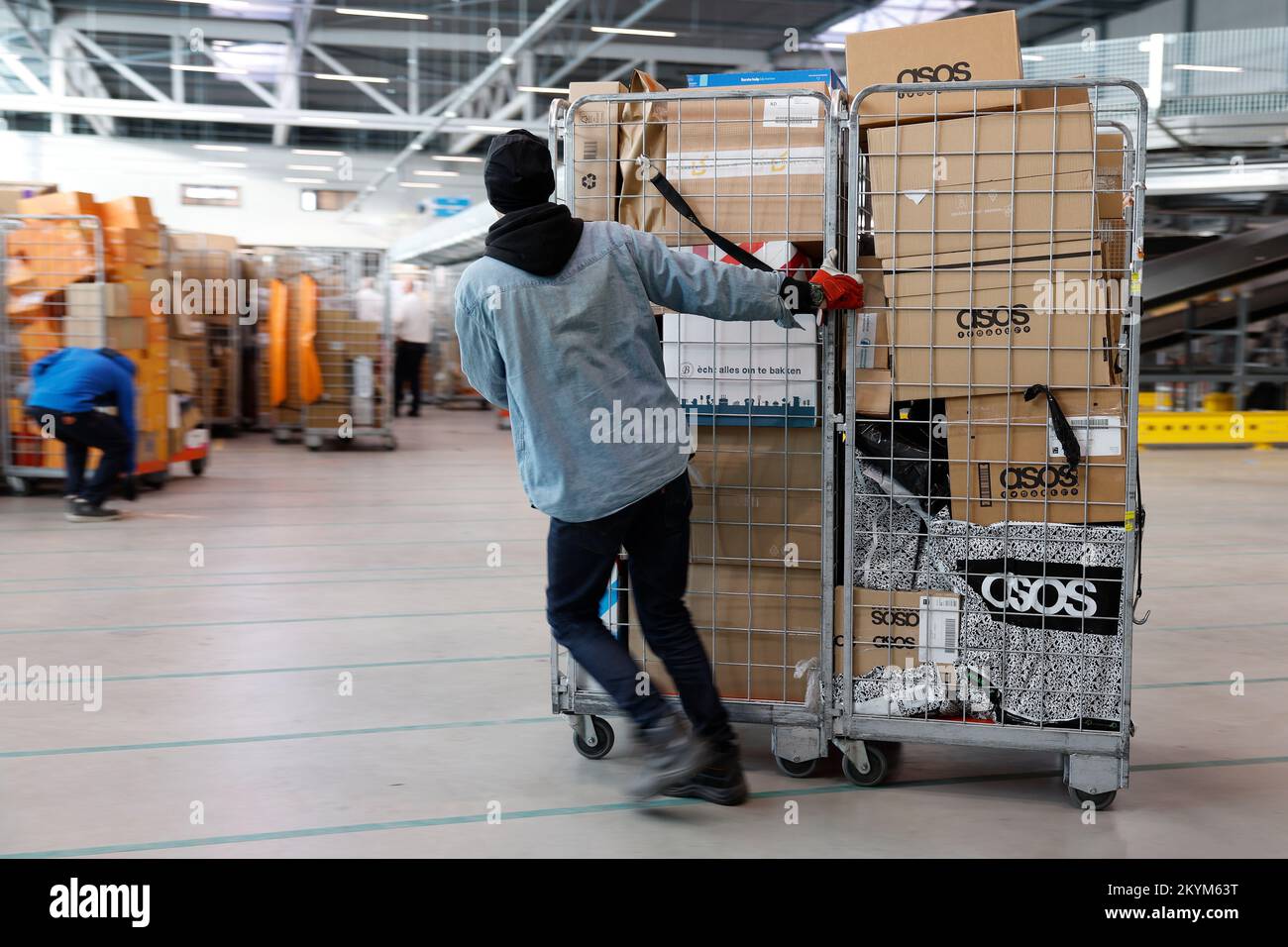 WESTZAAN - Employees of post and parcel delivery company PostNL sort ...