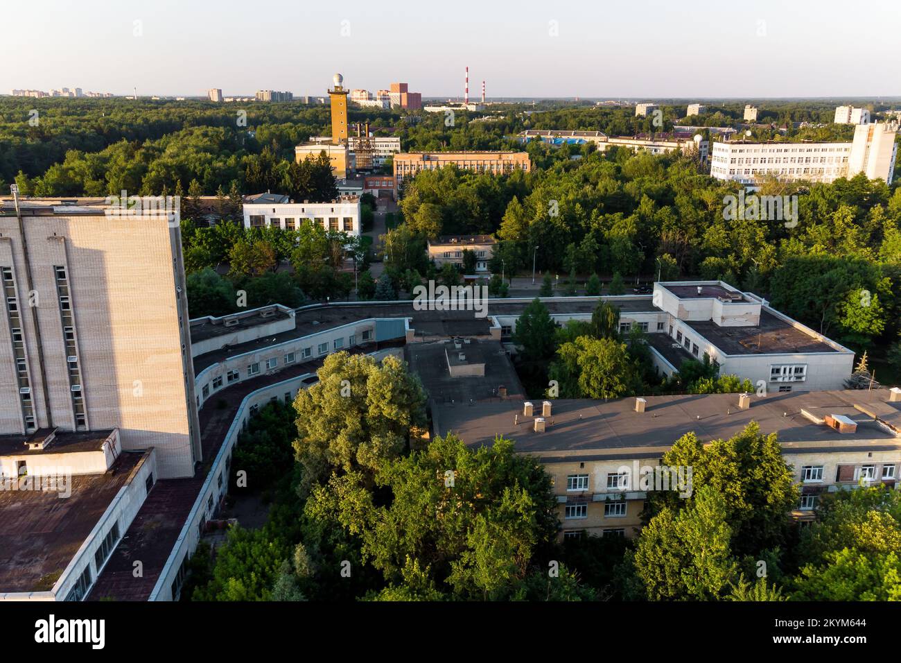 Soviet urban architecture surrounded by trees, aerial view. Obninsk ...