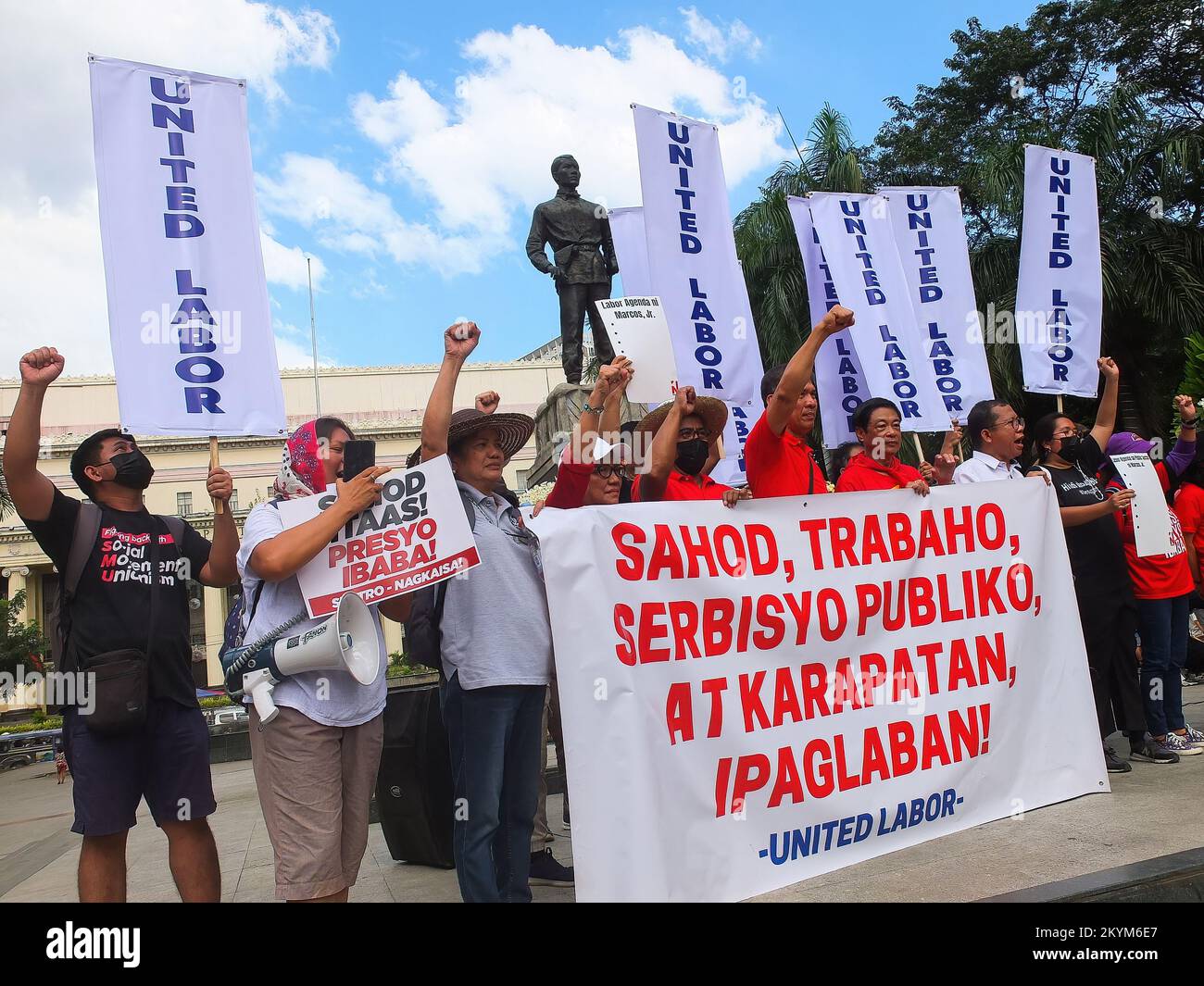 Protesters make gestures while holding banners on Bonifacio Day calling ...