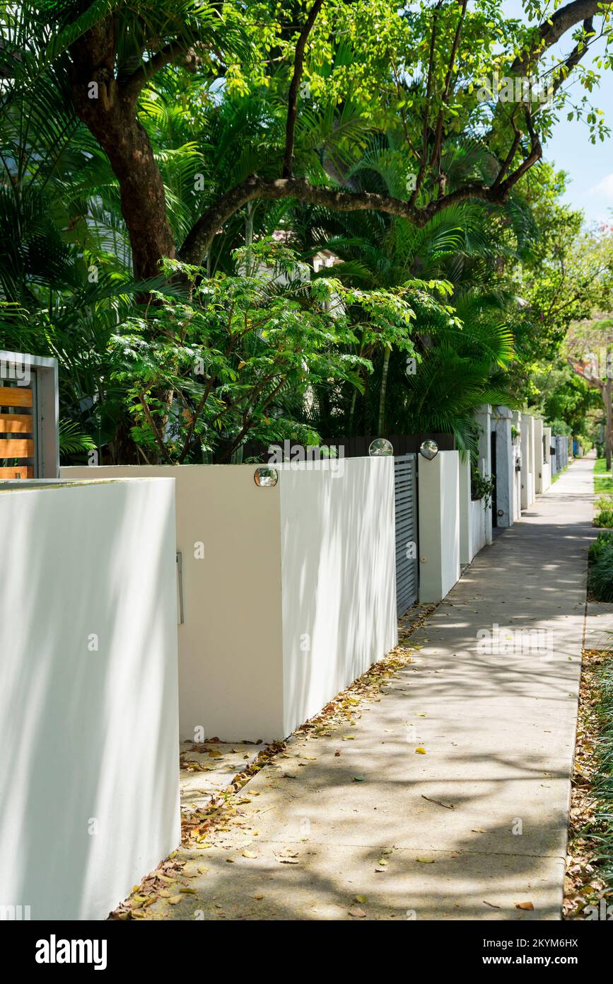 Concrete path outside the concrete walls of residences at Miami ...