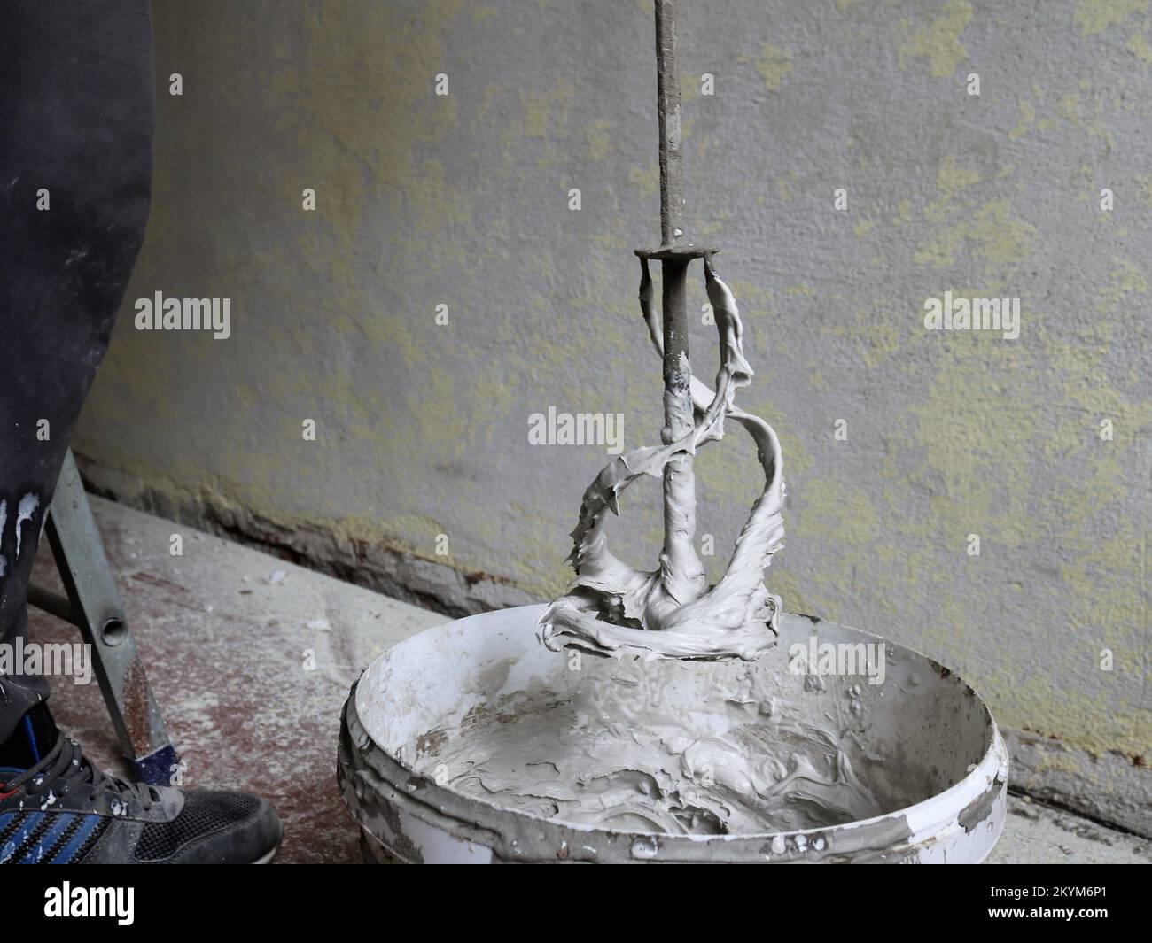 Mixing cement in a bucket hi-res stock photography and images - Alamy