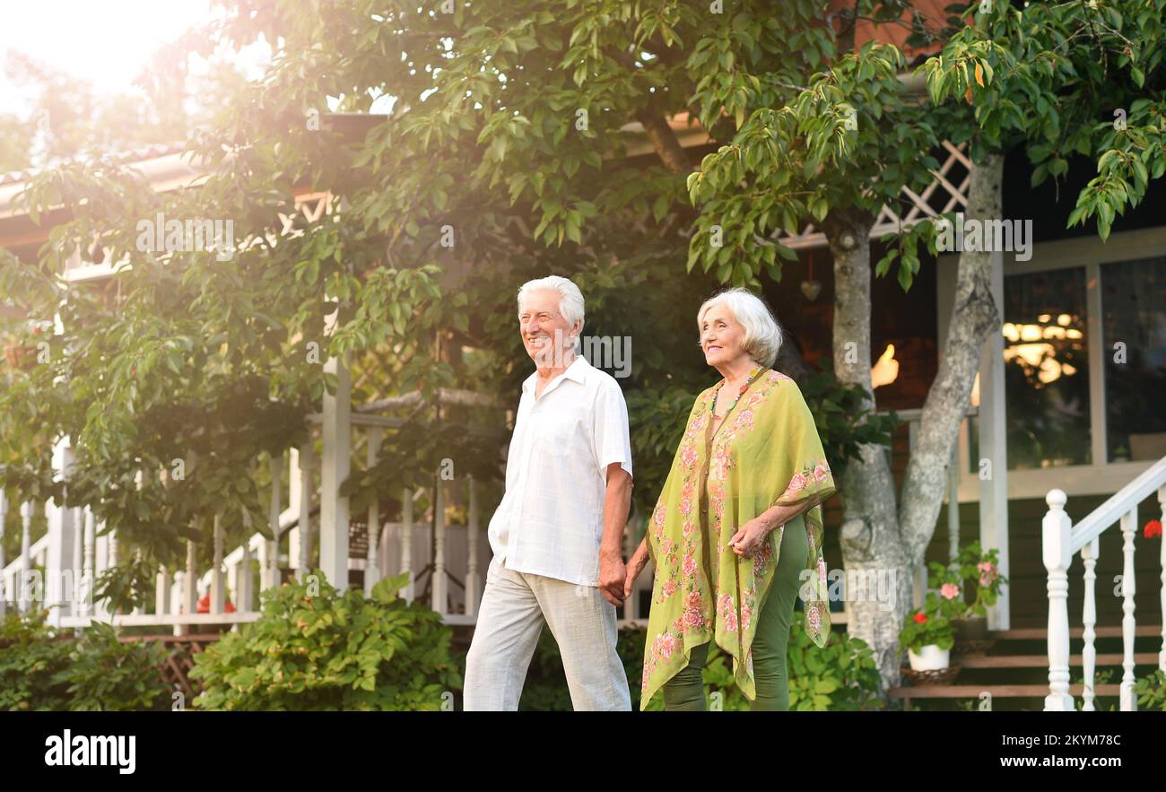 Elder couple near house hi-res stock photography and images - Alamy