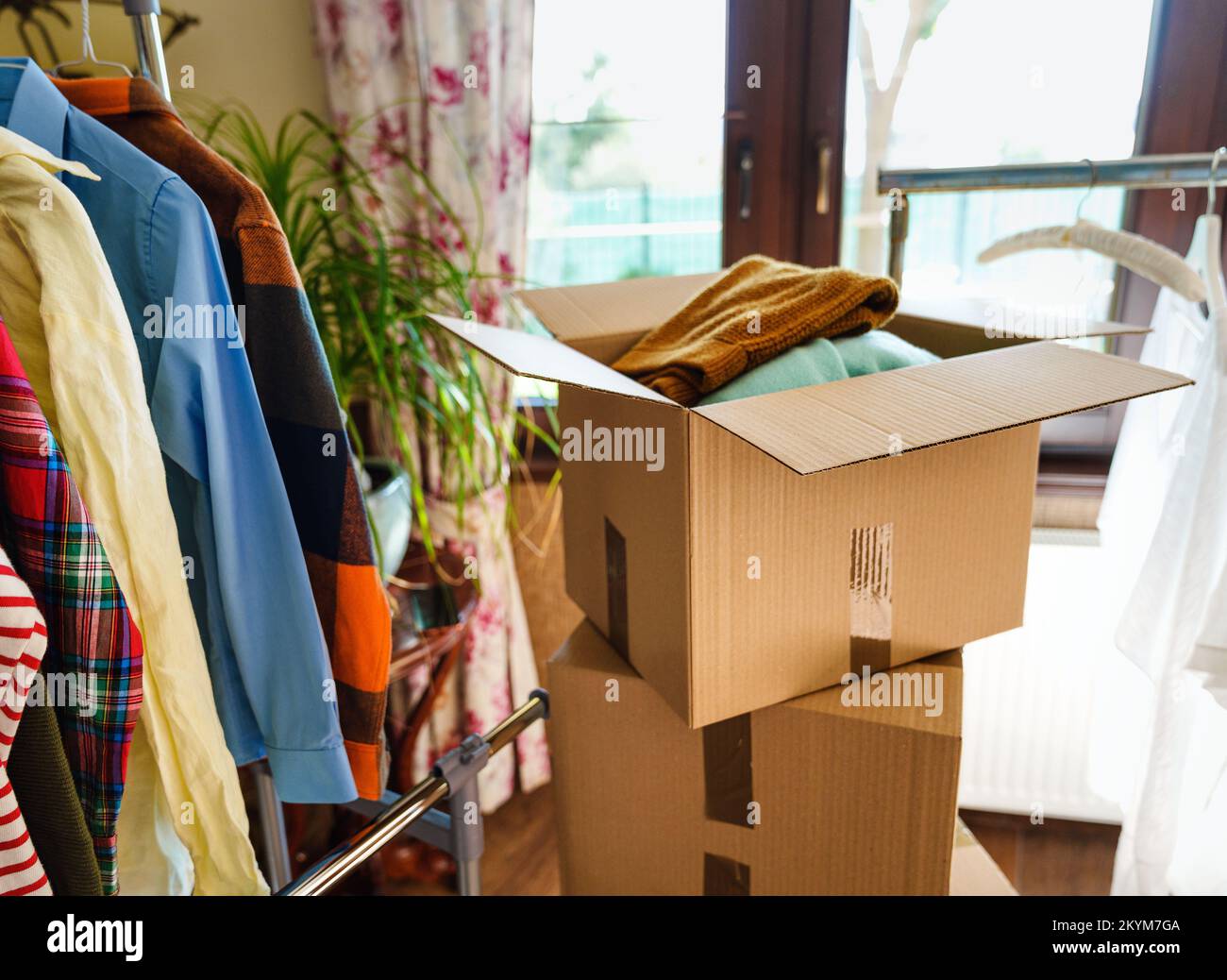 Pre owned clothes resale or donation Stock Photo - Alamy