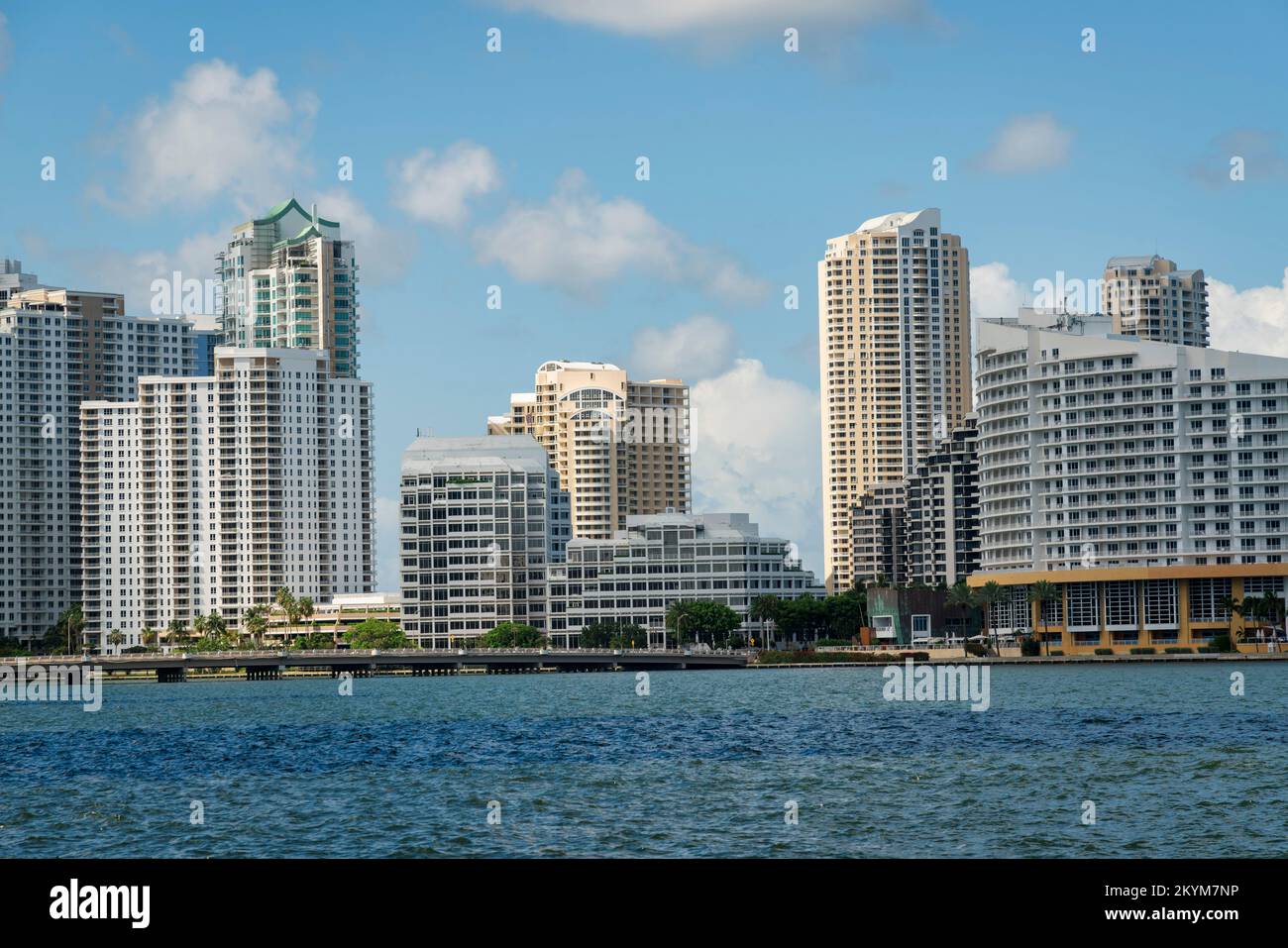 Cityscape views across the ocean at the bay in Miami, Florida. There is ...