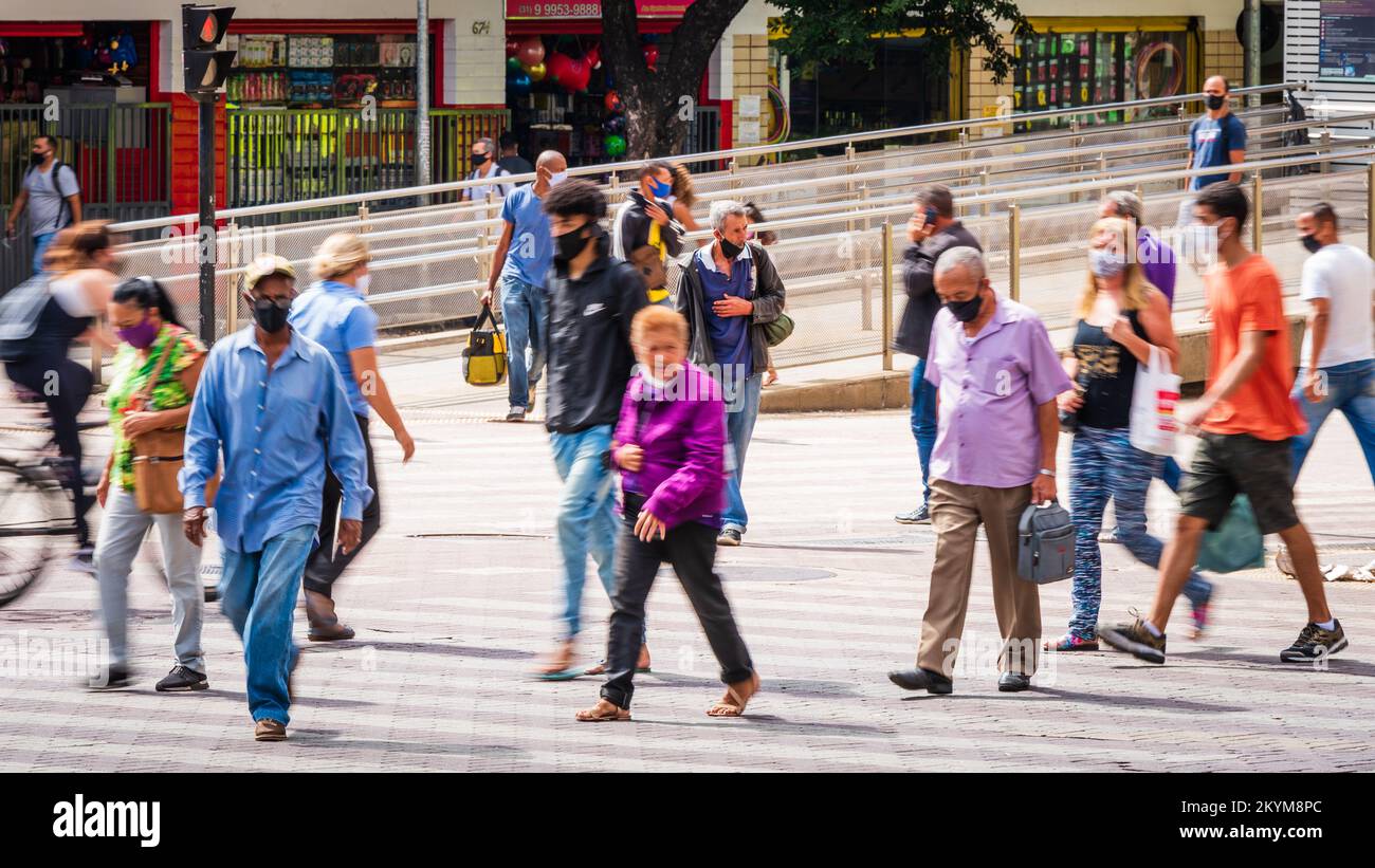 Pedestrians, old men, old women, low income people crossing a street in ...