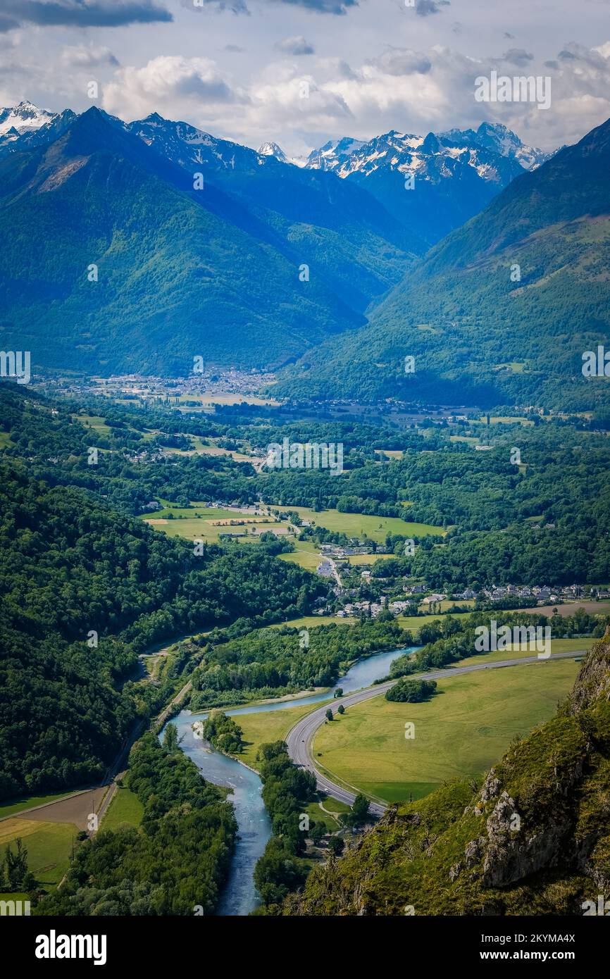 View on the Gave de Pau river valley and the snow covered mountains of ...