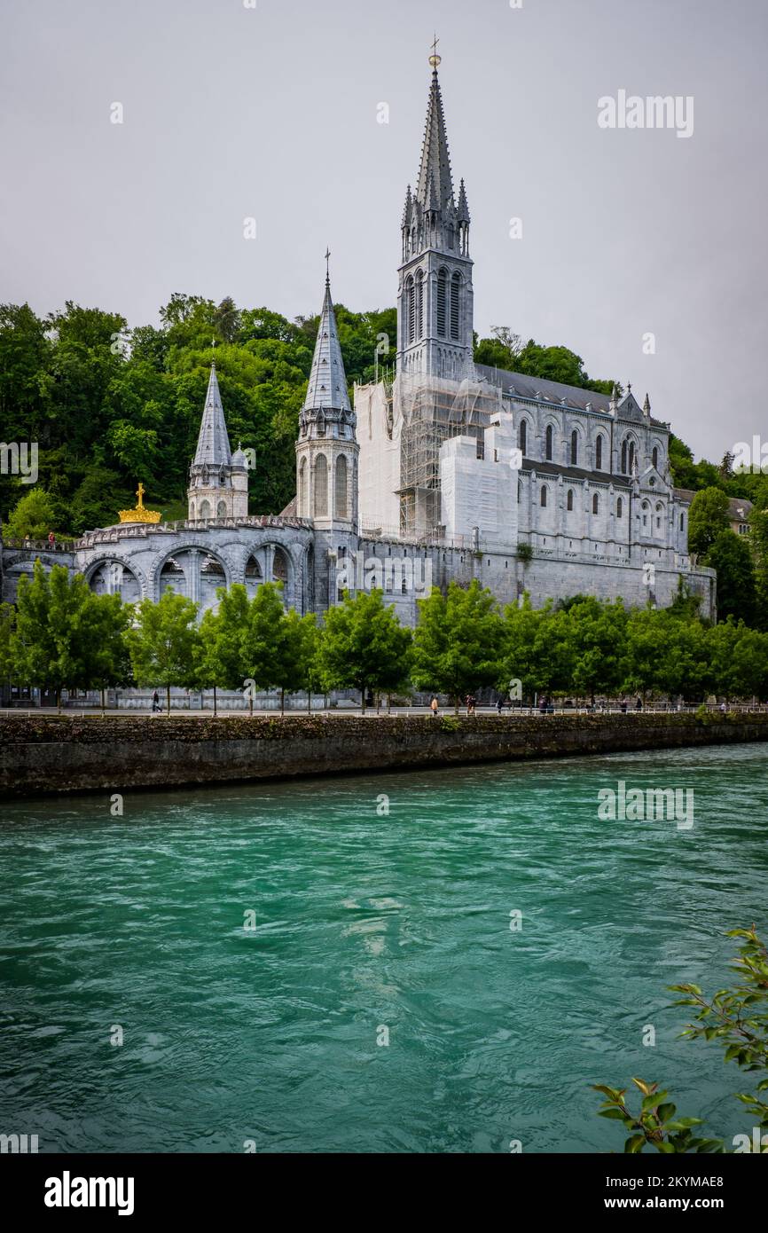 View on the 19th century Notre Dame Basilica of Lourdes in the French ...