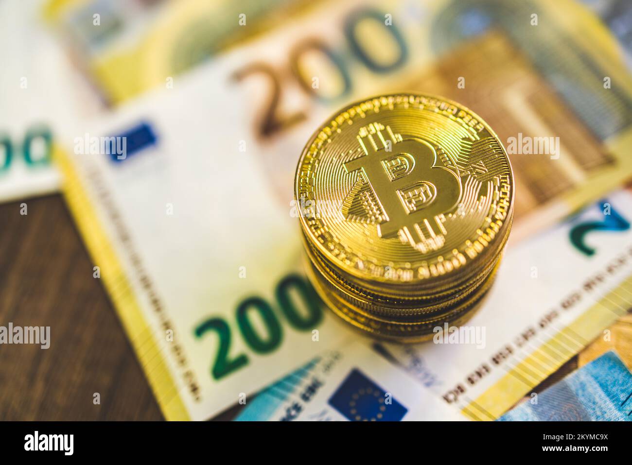 Cryptocurrency. Bitcoin virtual money. Golden coins and the euro ...