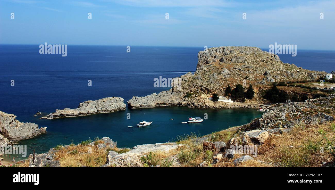 Rhodes, Greece May 7, 2012: A beautiful bay is located among the rocks ...