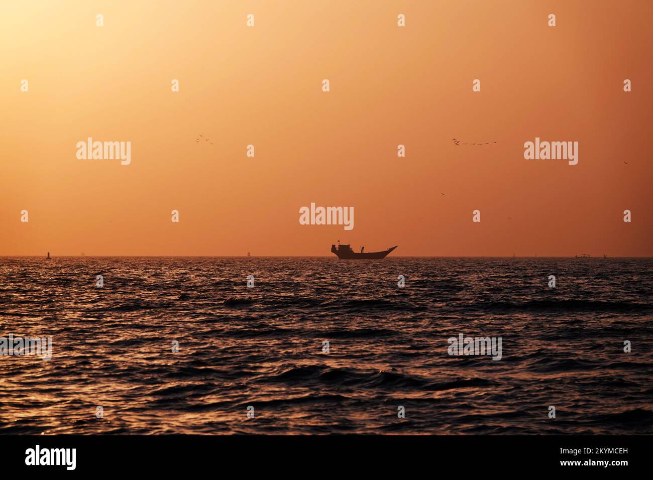 Sea sunset on the Persian Gulf Stock Photo - Alamy
