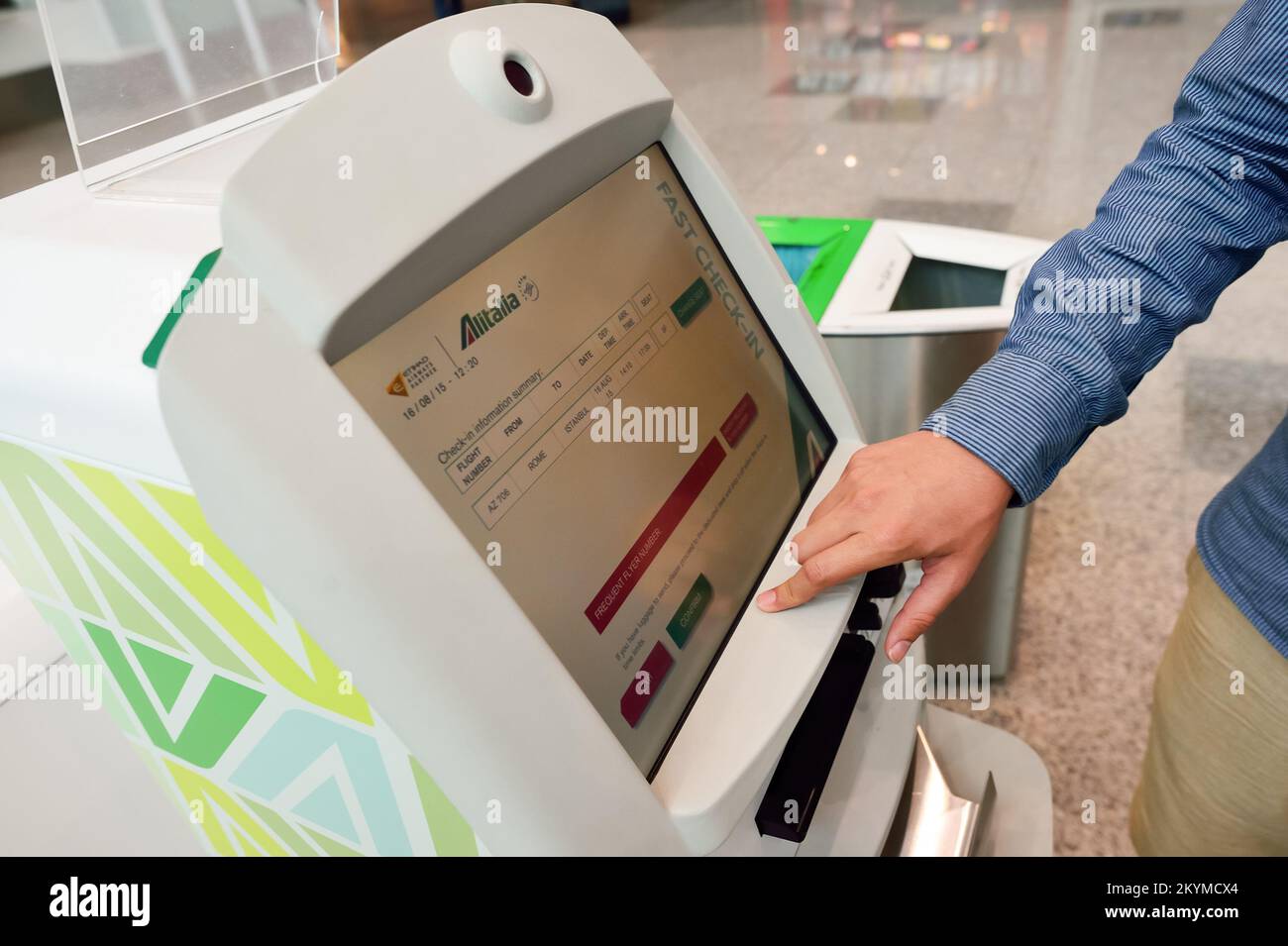 ROME, ITALY - AUGUST 16, 2015: people use self check-in kiosks in ...