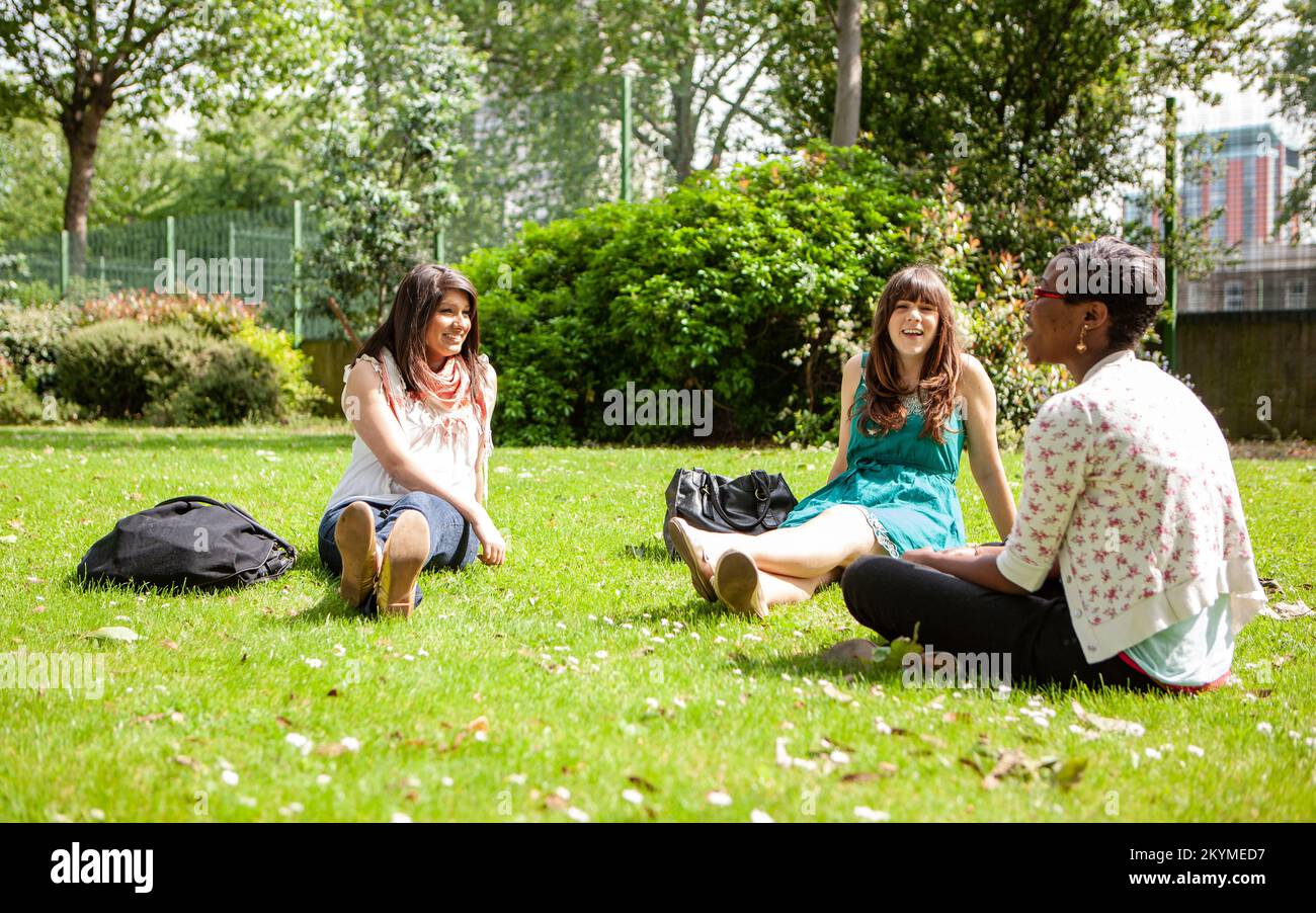 Teenage Friends, Time Out. Late teenage female students sitting ...